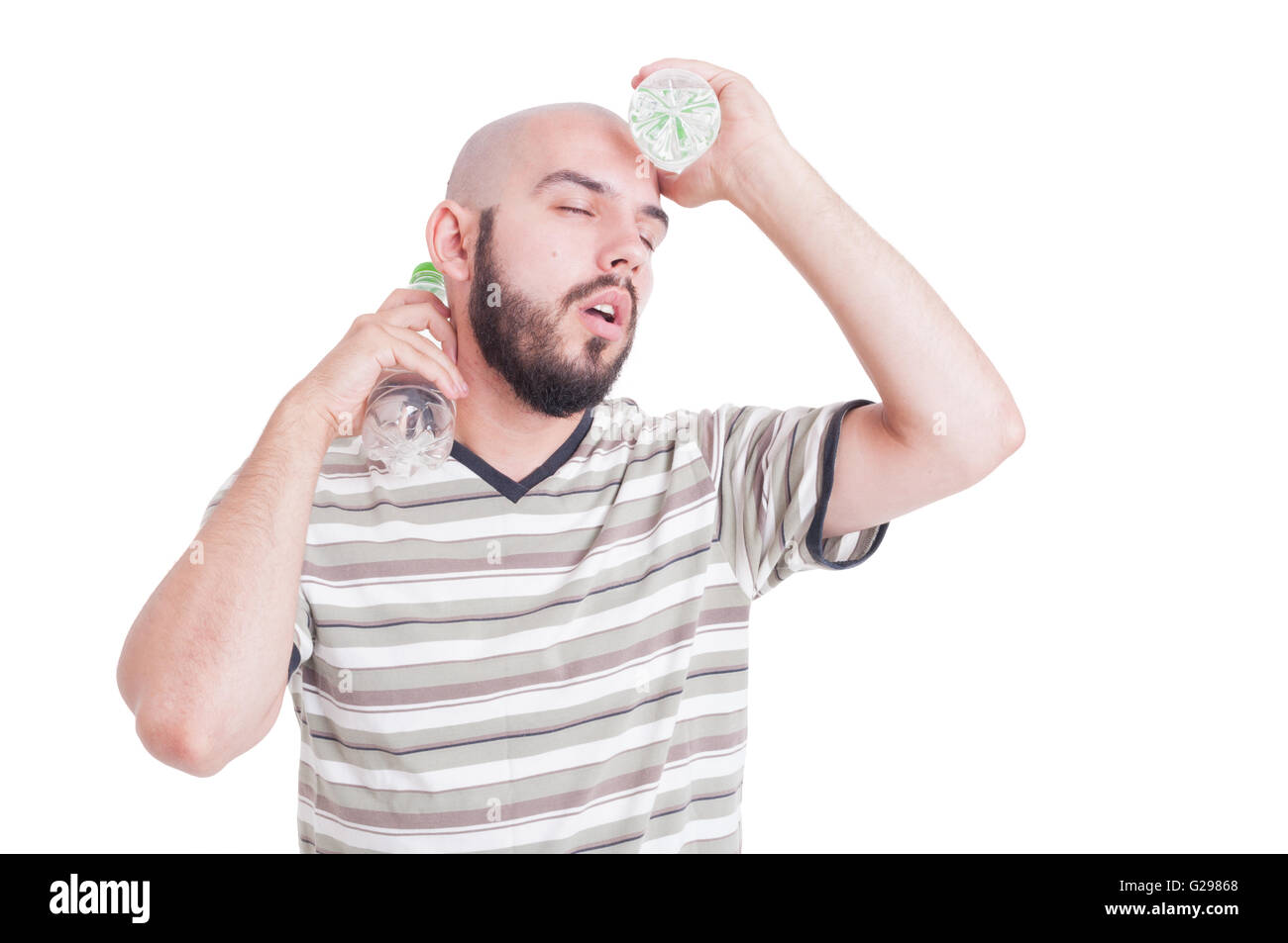 Heated man cooling down with cold water plastic bottles touching his ...