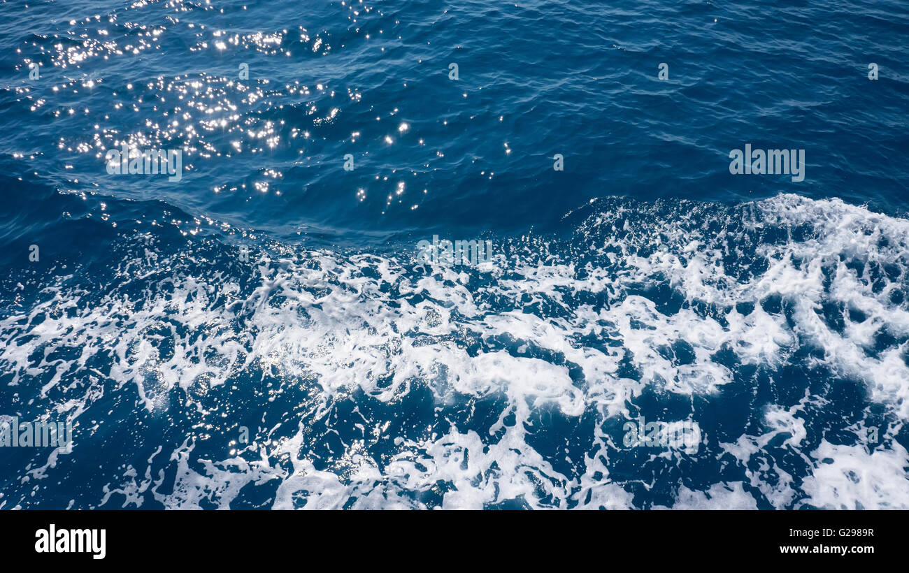 Restless foamy blue sea water from above Stock Photo - Alamy