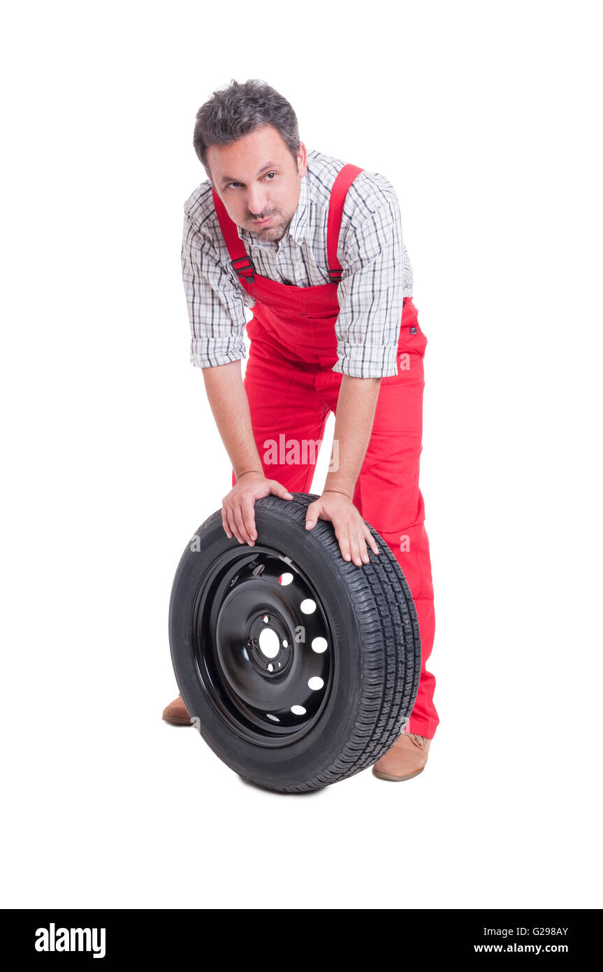Tired mechanic resting on car wheel isolated on white Stock Photo - Alamy