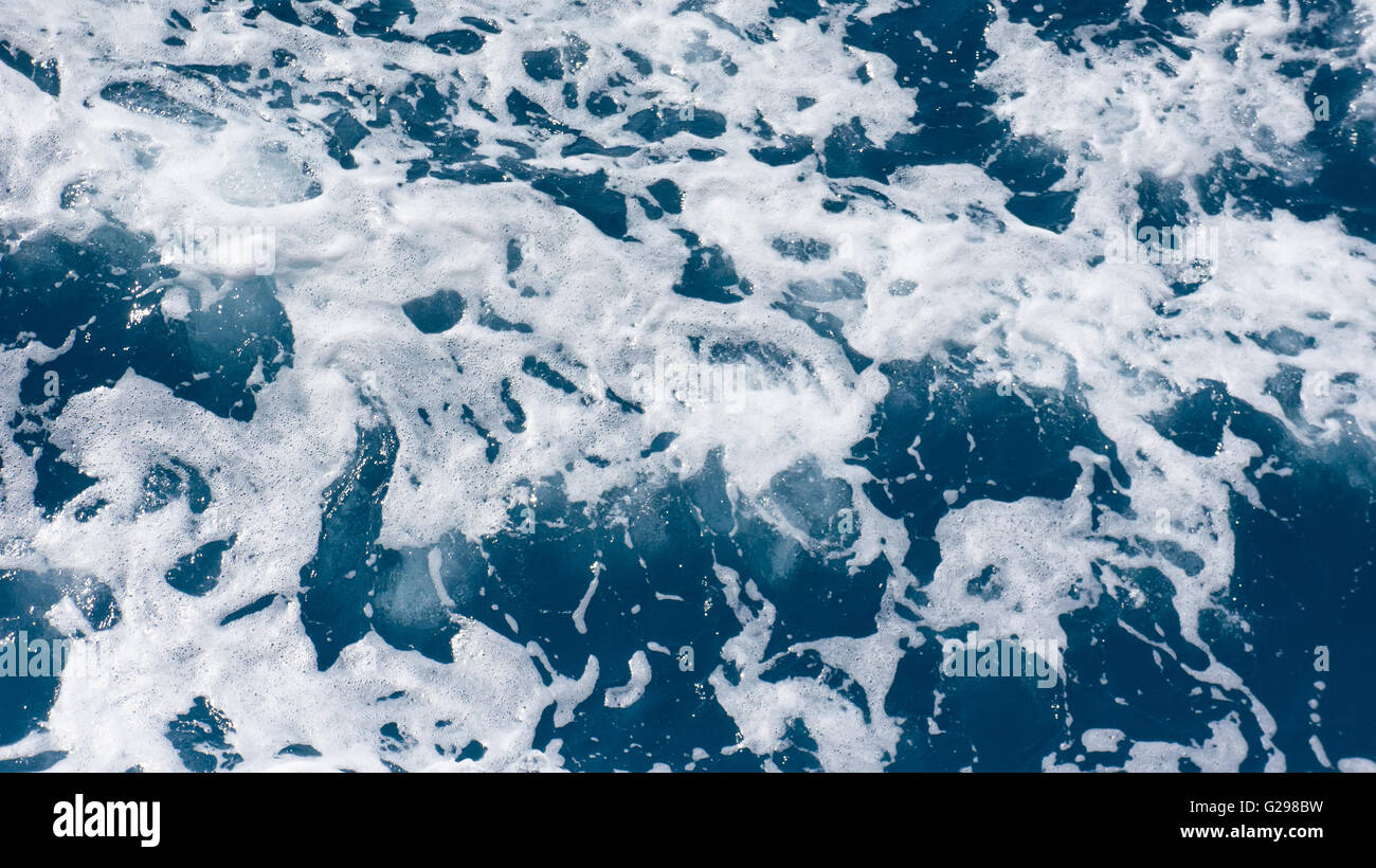 Restless foamy blue sea water from above Stock Photo - Alamy