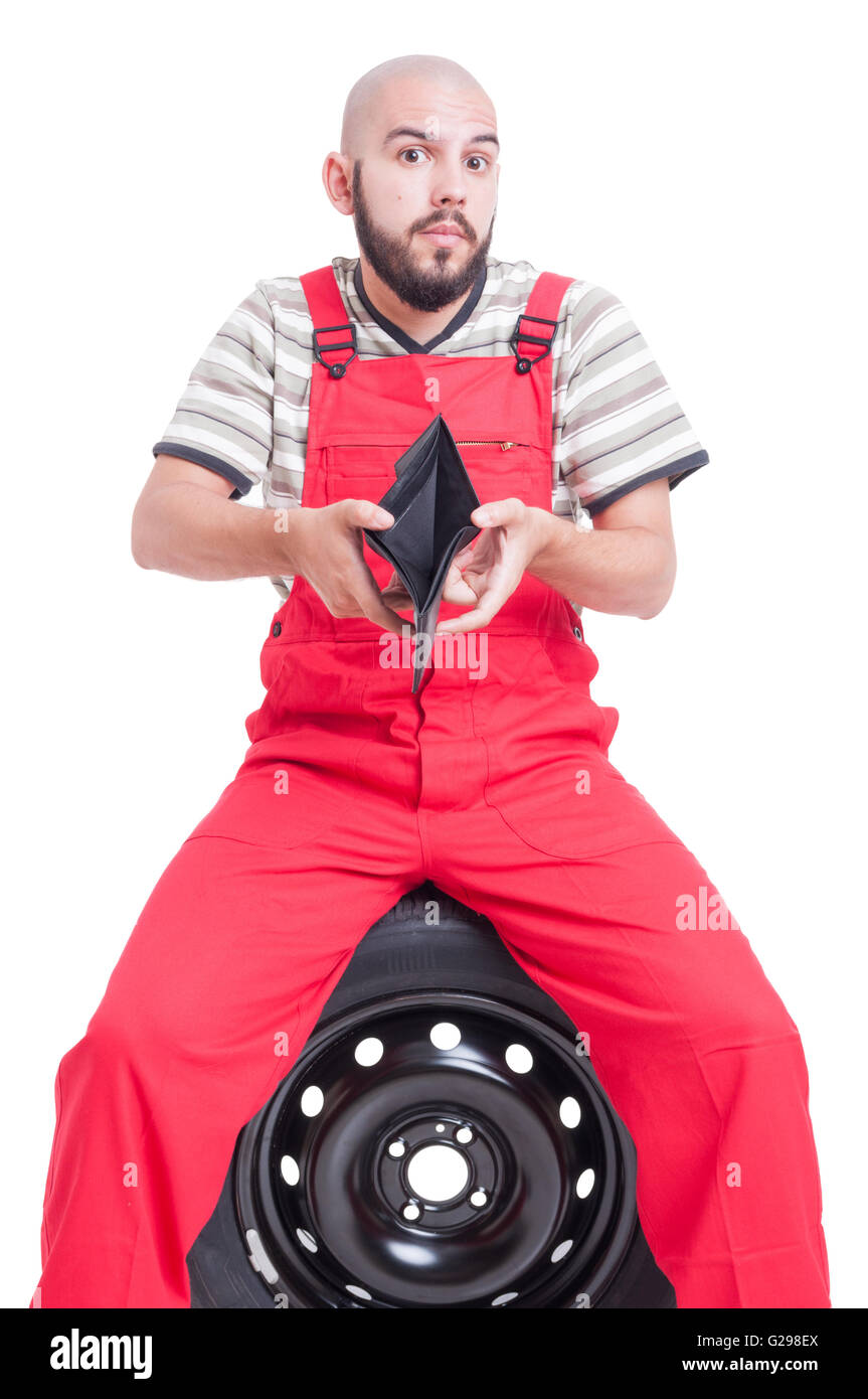 Broke and poor mechanic showing empty wallet as bankruptcy concept ...
