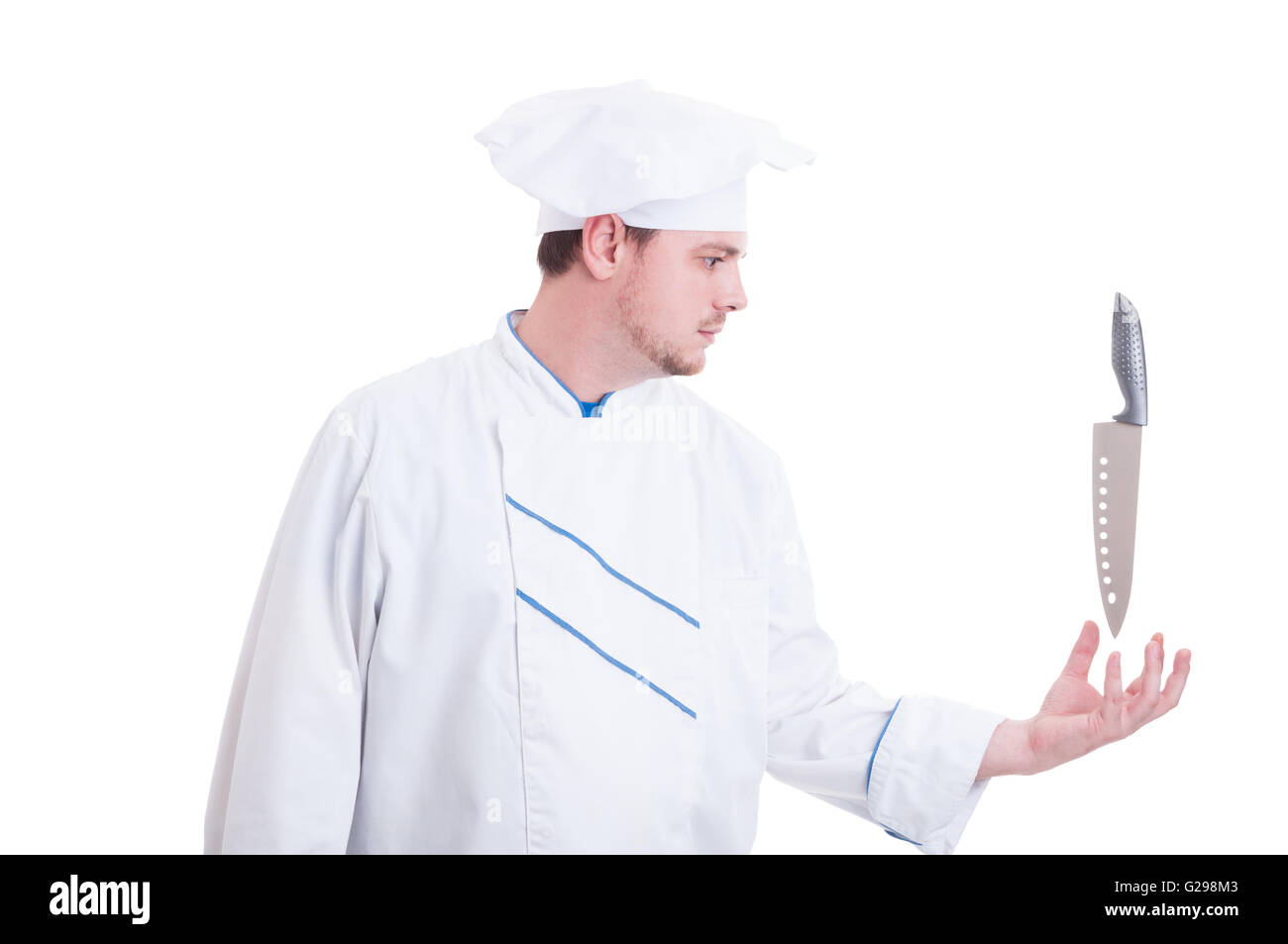 Chef with super powers holding floating knife acting as a super hero ...