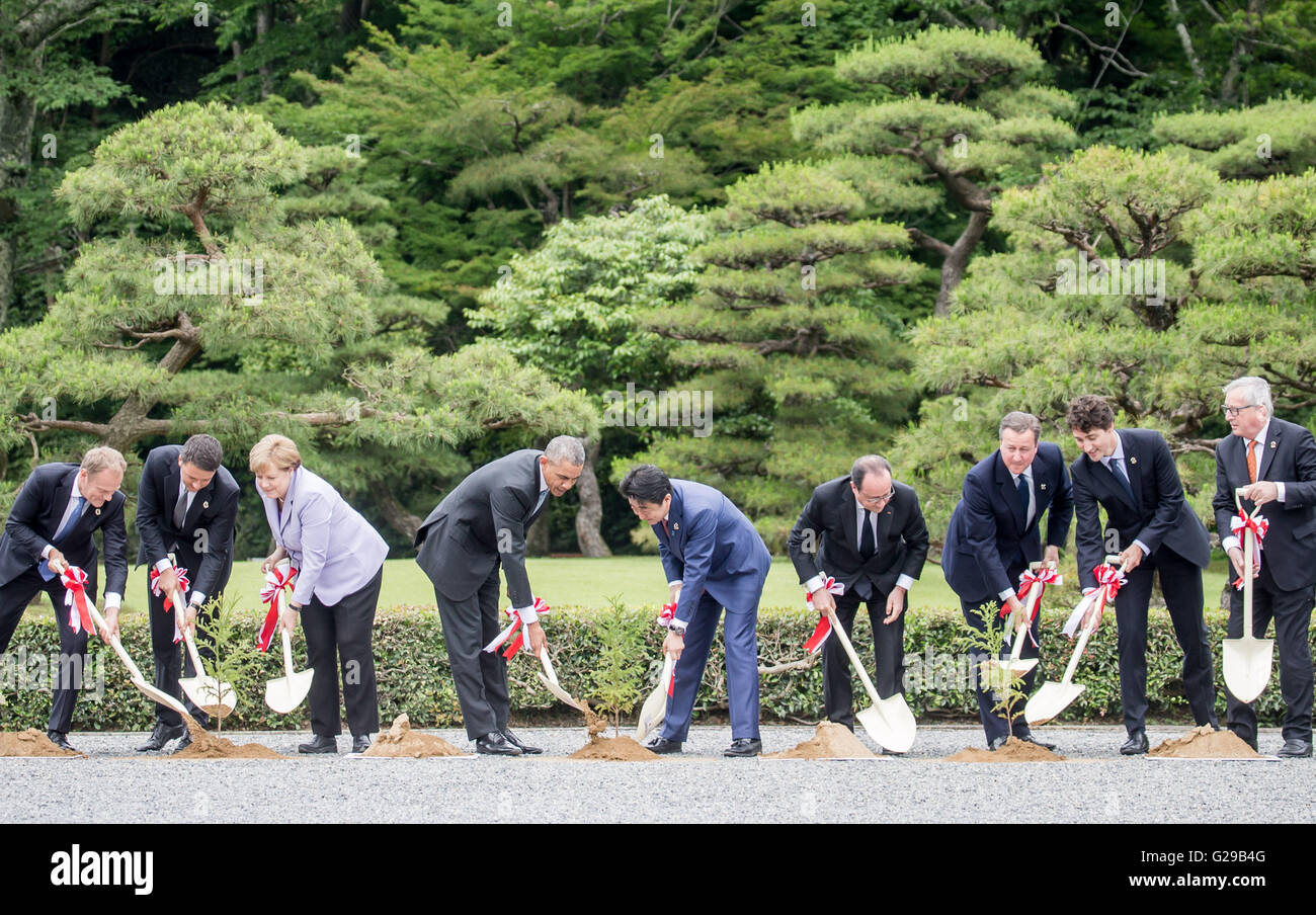 German Chancellor Angela Merkel planting a tree in the garden of the ...