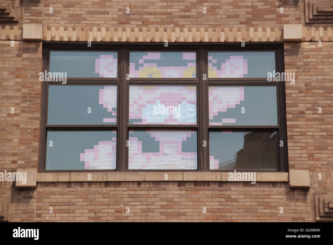 Pictures and writings made with Post-its hanging in office buildings in ...