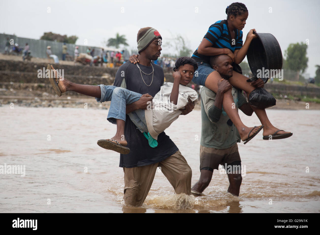 Carrying each other and their belongings, Haitians illegally cross the ...