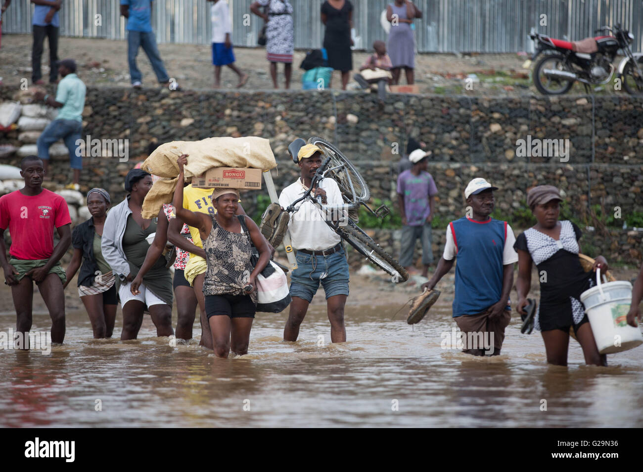 Carrying each other and their belongings, Haitians illegally cross the ...
