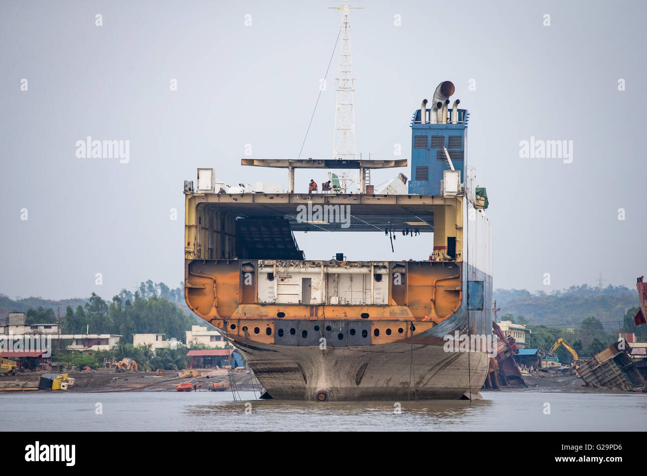 Partially broken down ocean ship in a ship breaking yard in Chittagong ...