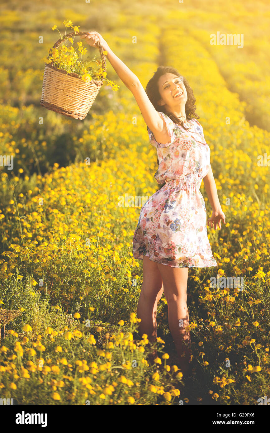 Girl Dancing In Field Of Flowers
