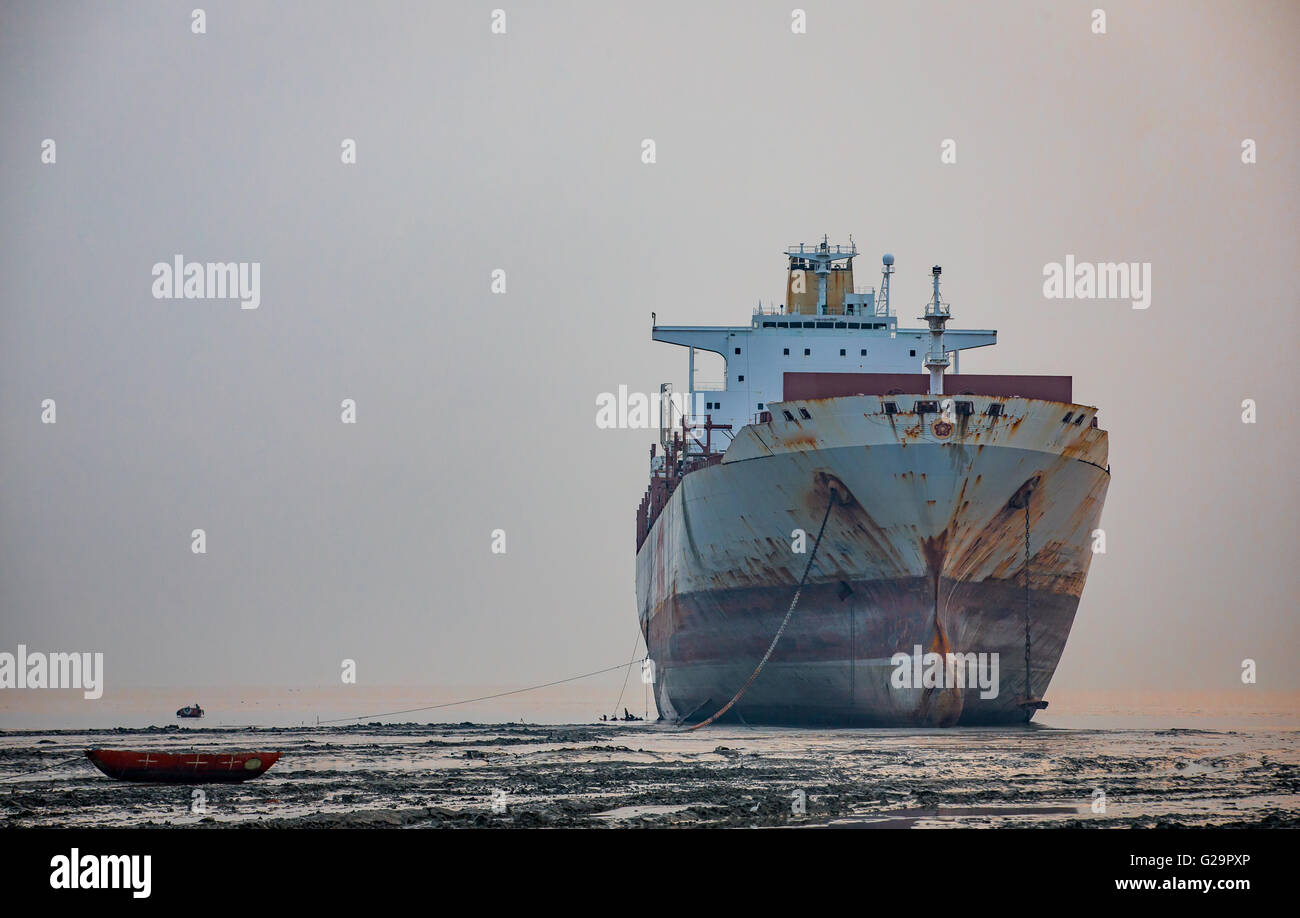 Partially broken down ocean ship in a ship breaking yard in Chittagong ...