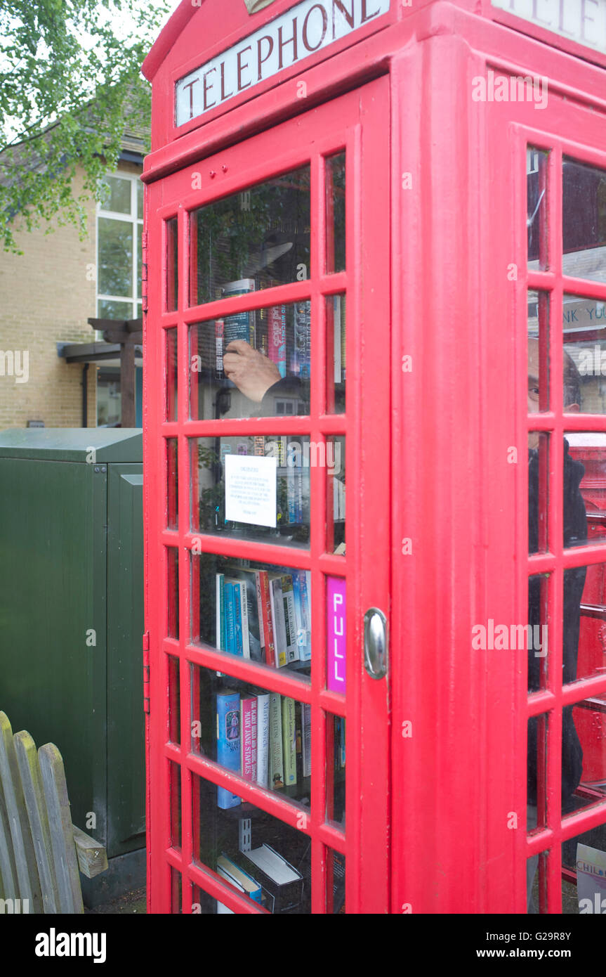 Telephone box converted to a lending library for books Stock Photo - Alamy