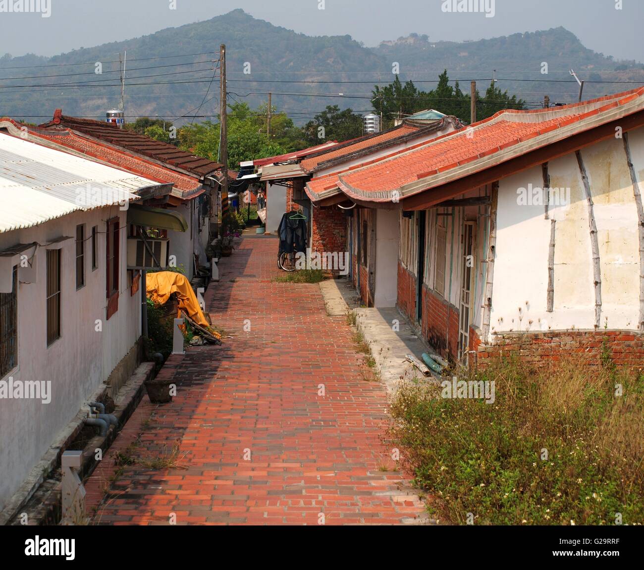An old Chinese village with a red brick street Stock Photo - Alamy
