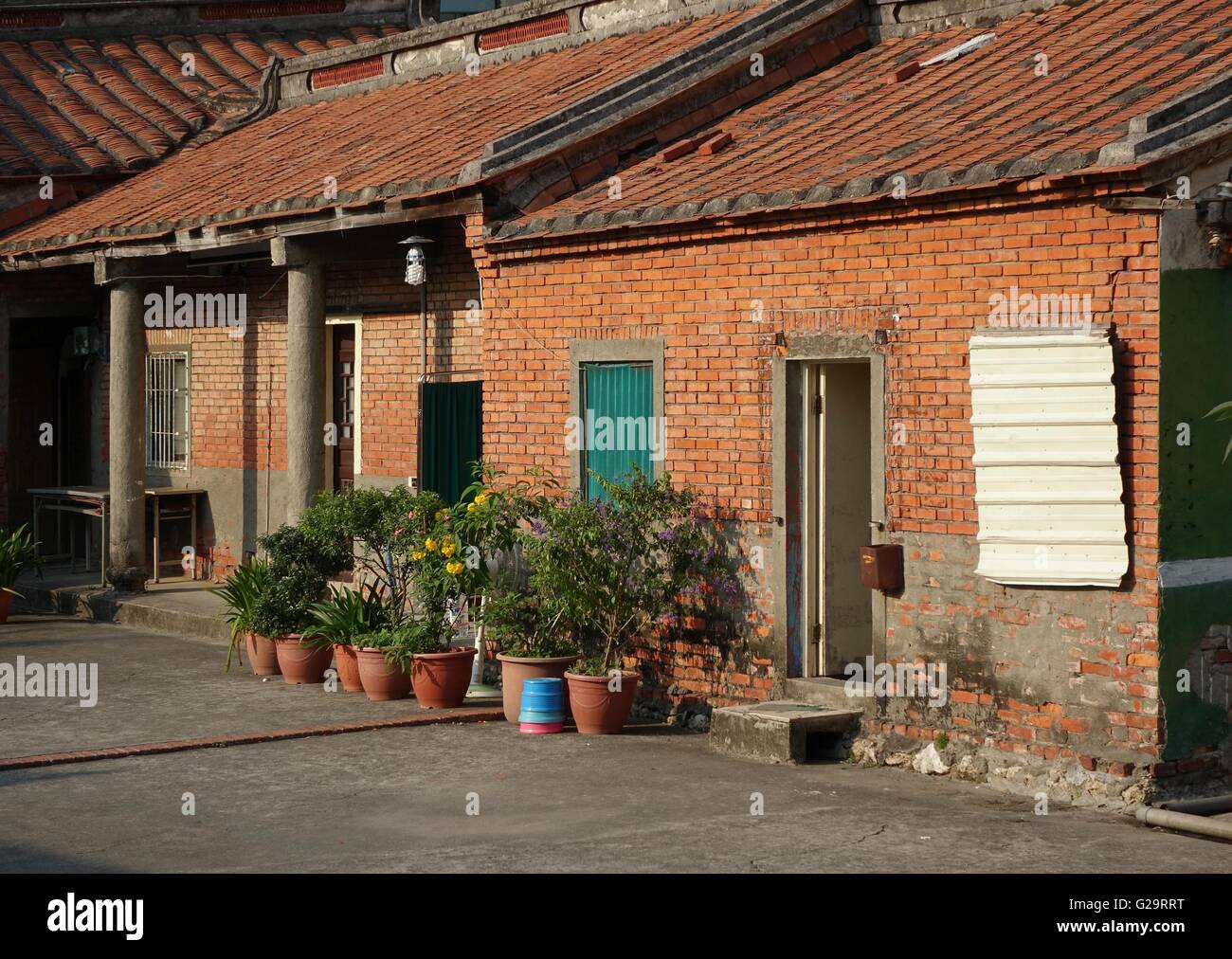 A traditional Chinese farmhouse with brick walls and slanted roof Stock ...