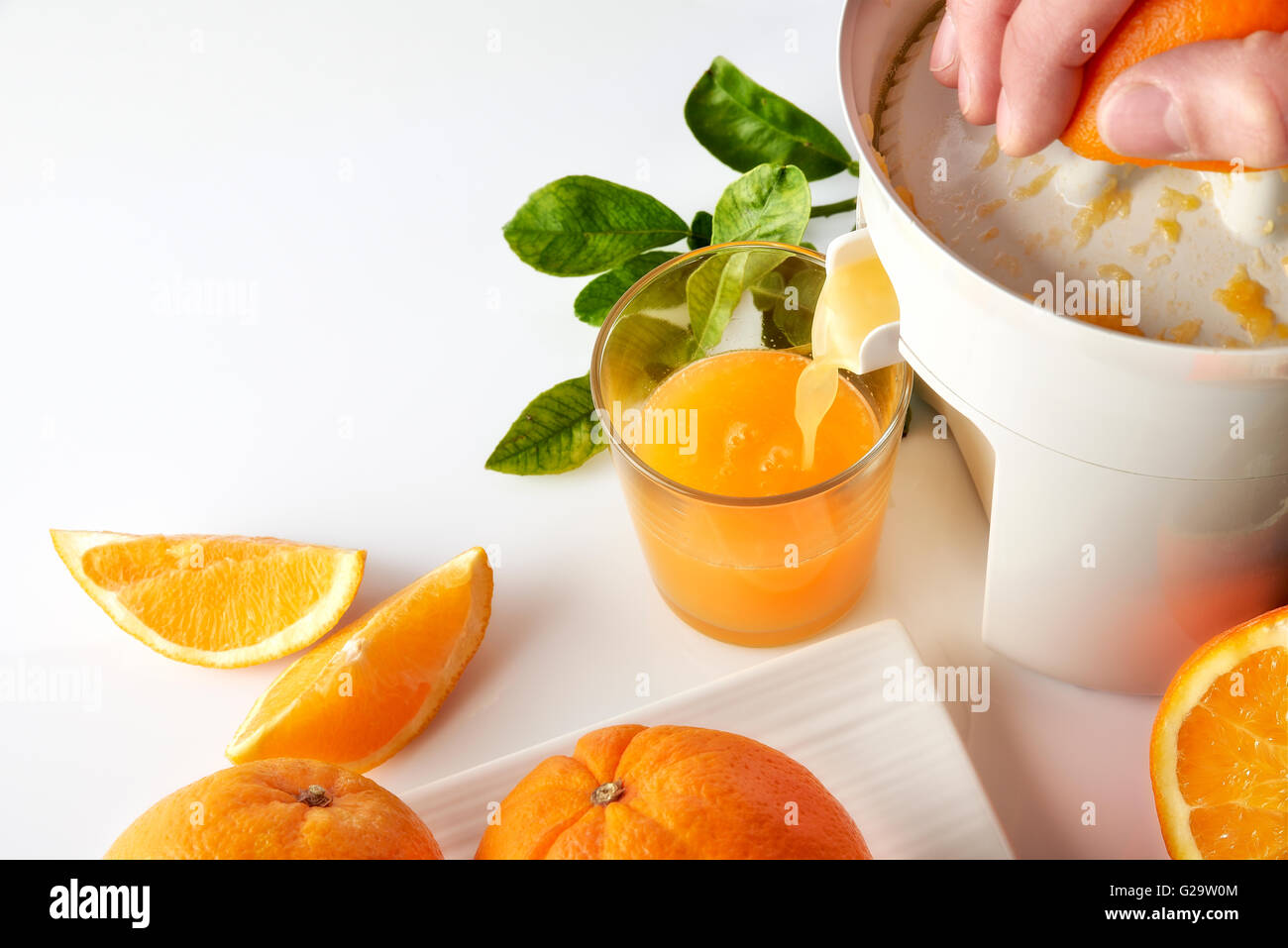 Hand squeezing orange juice hi-res stock photography and images - Alamy