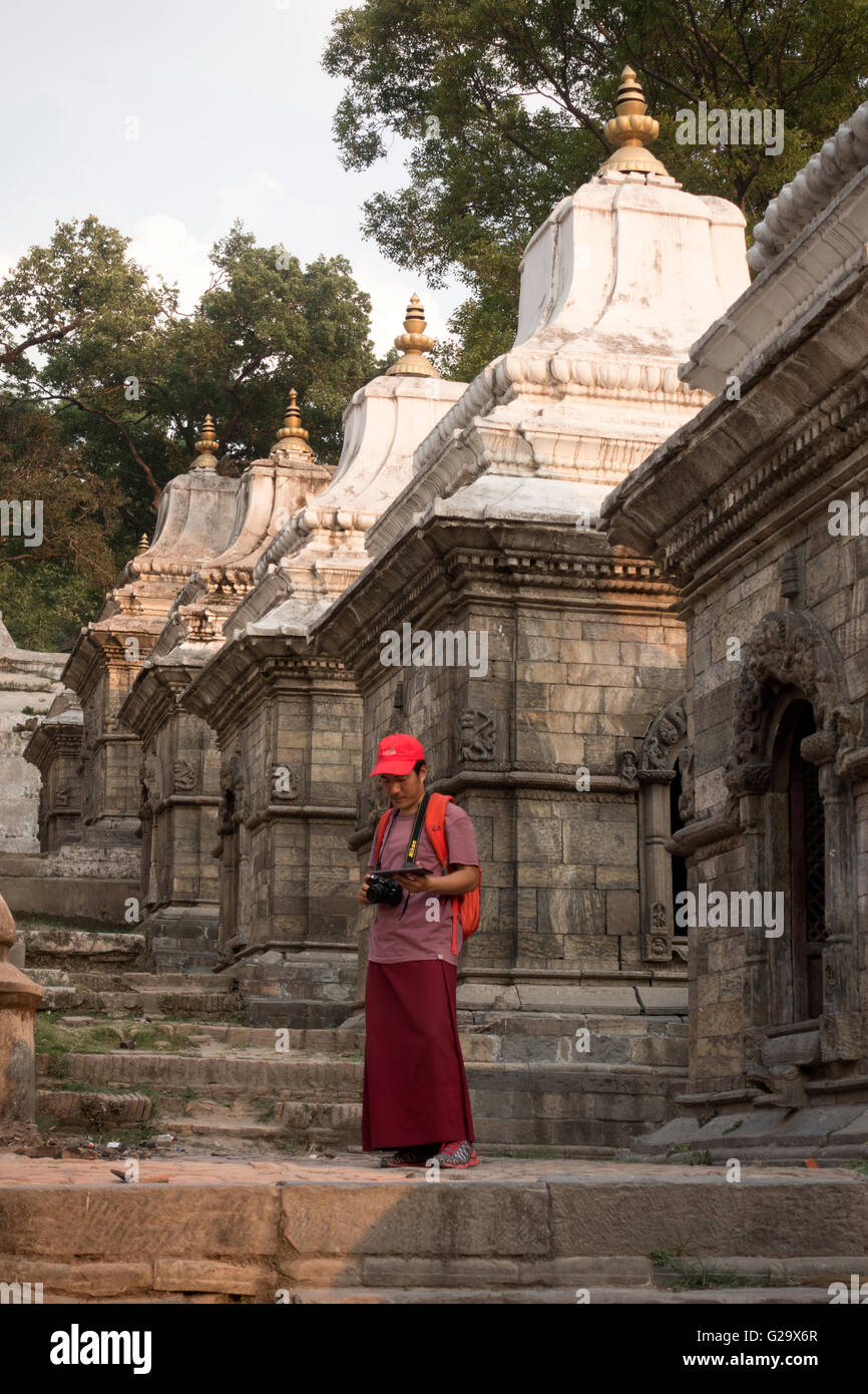 Monk with camera at Pashupatinath Temple, Kathmandu, Nepal Stock Photo ...