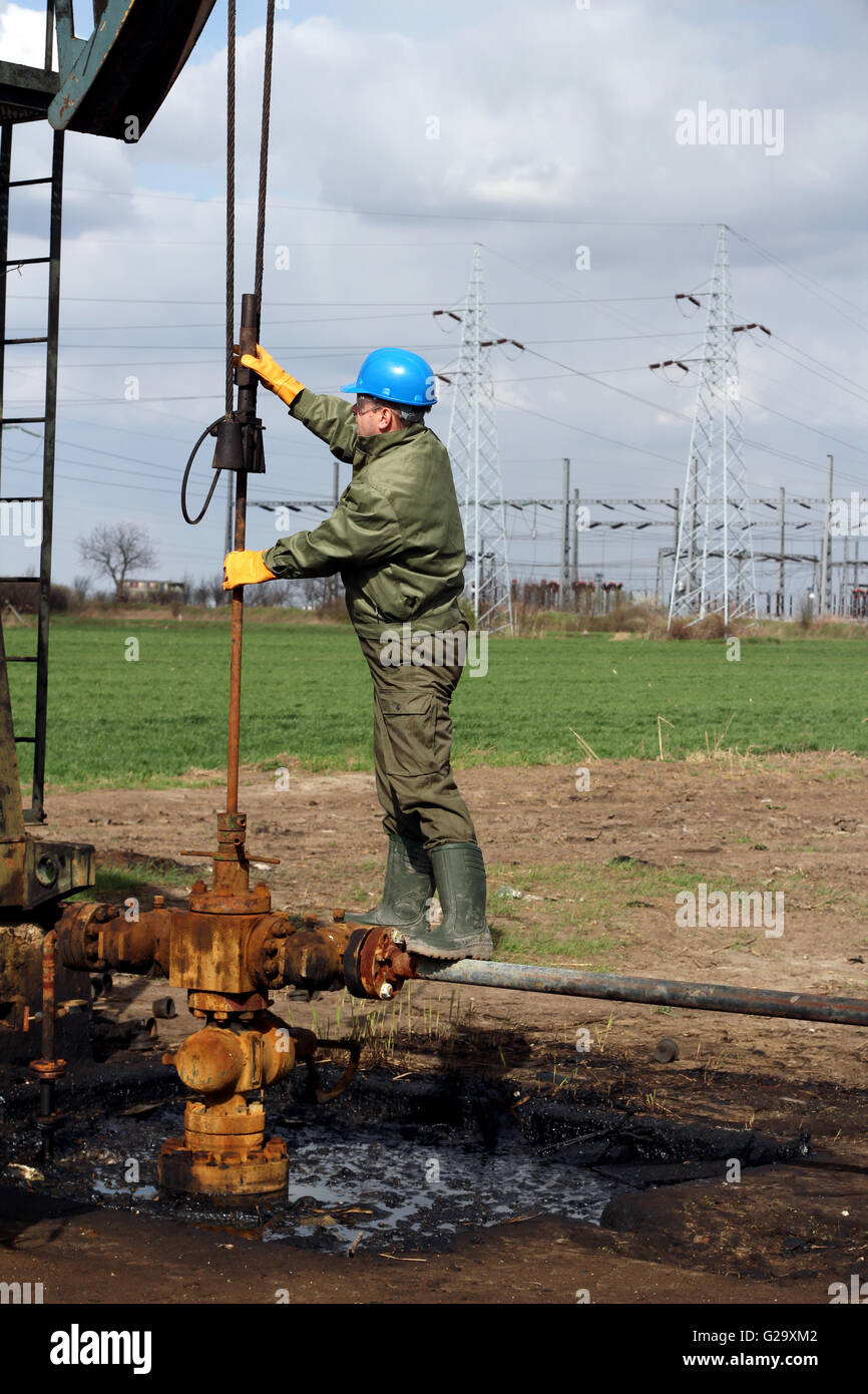 oil worker check oil pump Stock Photo - Alamy