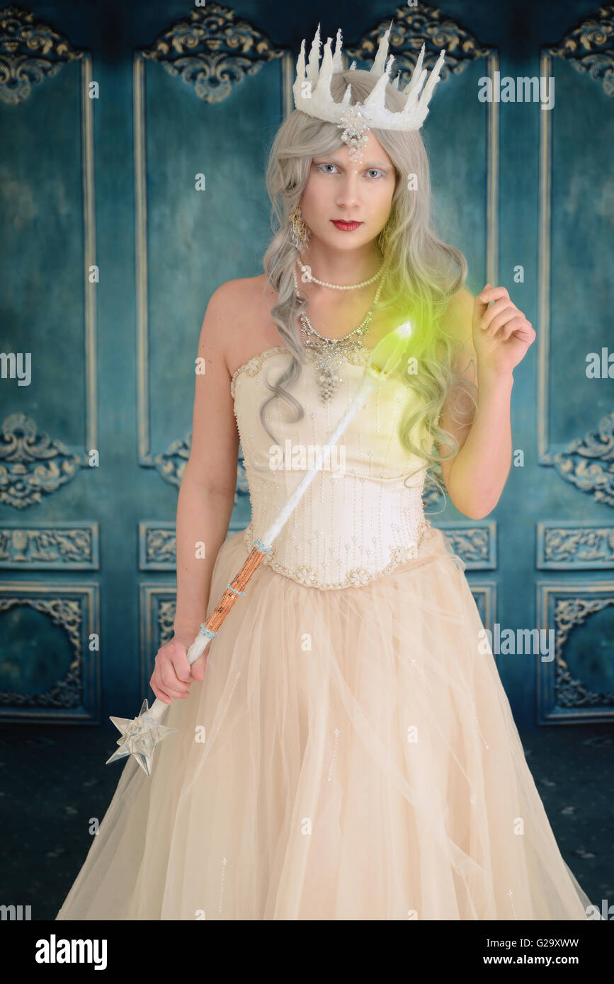 ice queen with wand making magic Stock Photo - Alamy