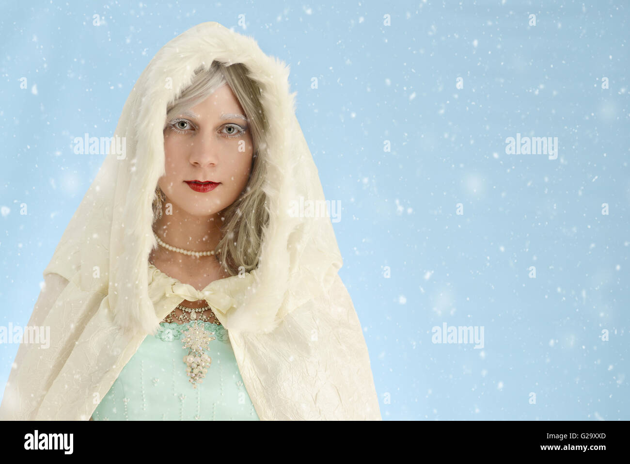 woman with cloak in the snow Stock Photo - Alamy