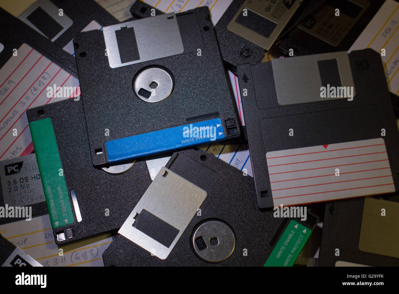 Pile of 3.5" floppy discs with colorful labels Stock Photo - Alamy