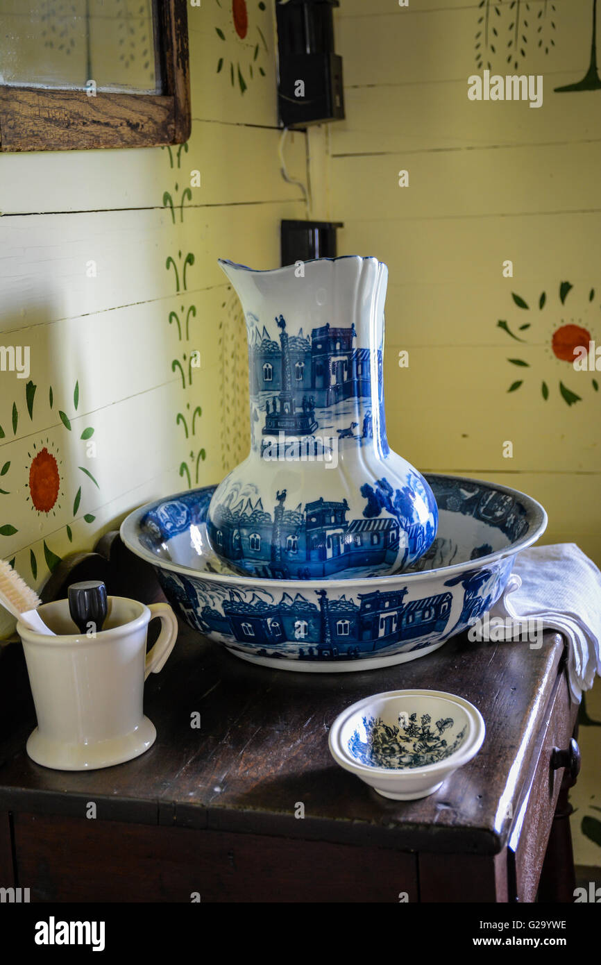 An Interior view of a rustic 19th Century American wash stand with ...