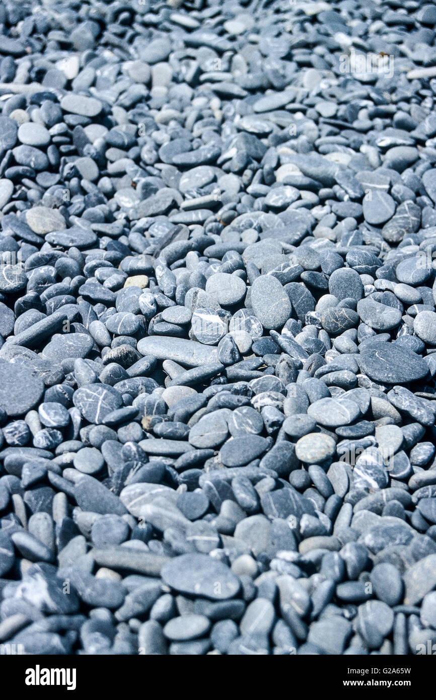 Thousands of rounded stones on a beach Stock Photo - Alamy