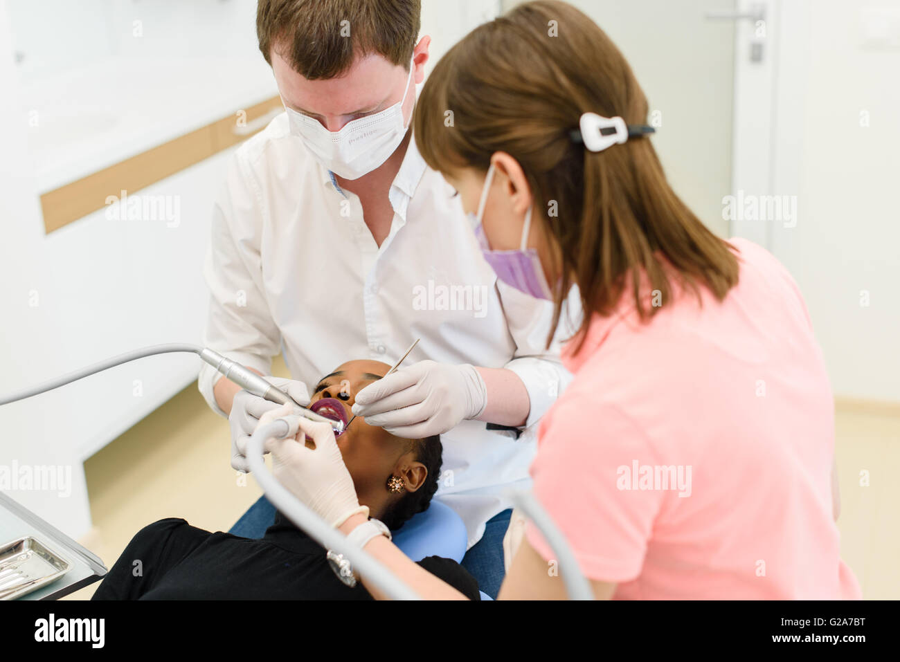 Nurse cleaning teeth hi-res stock photography and images - Alamy