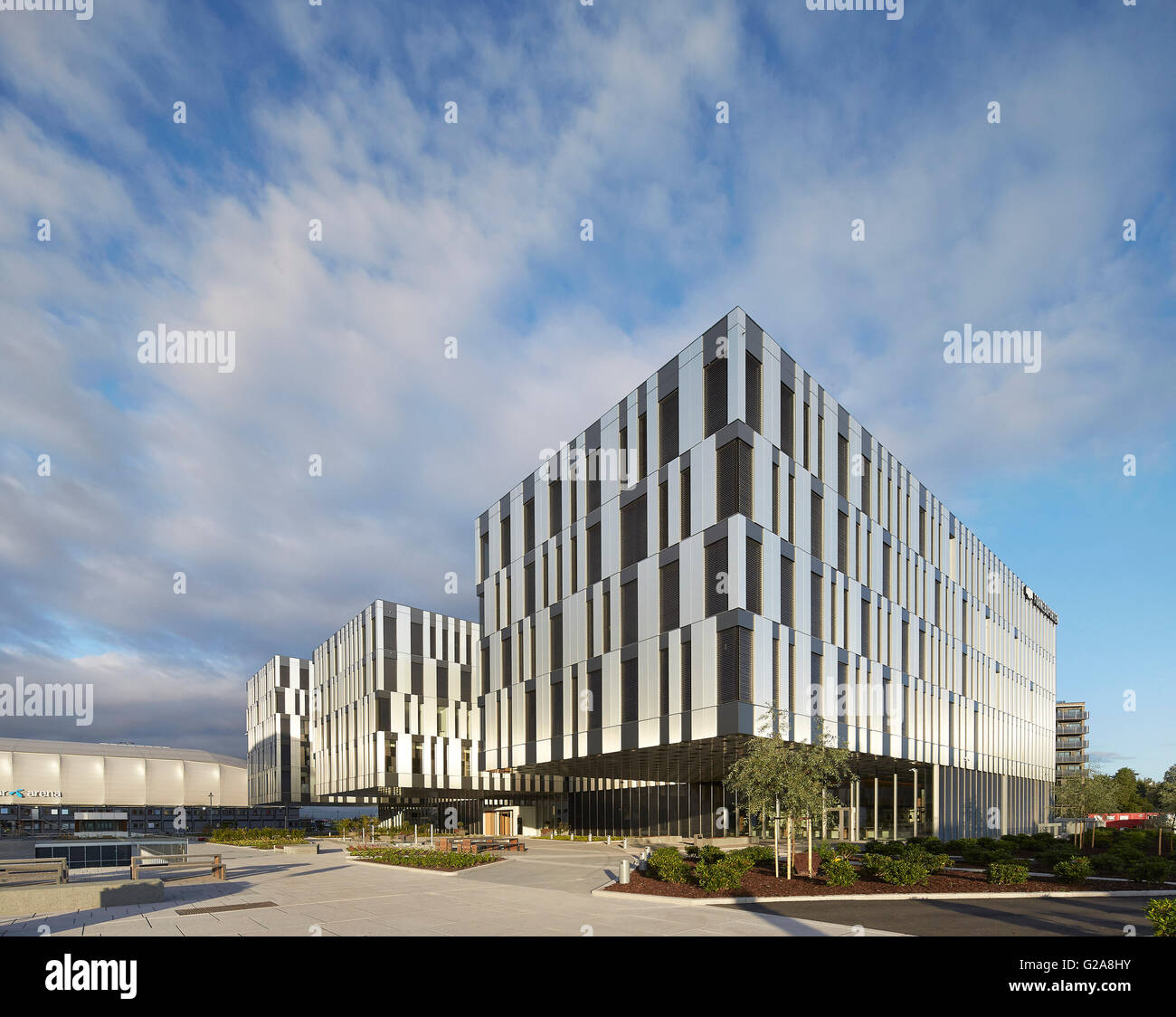 Corner elevation of landscaped square with cantilevering building ...