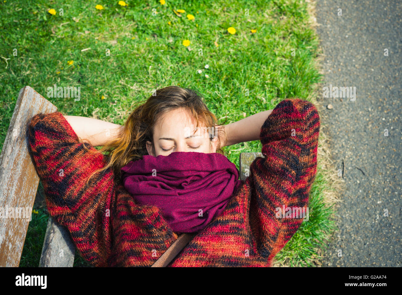 Woman sleeping on park bench hi-res stock photography and images - Alamy