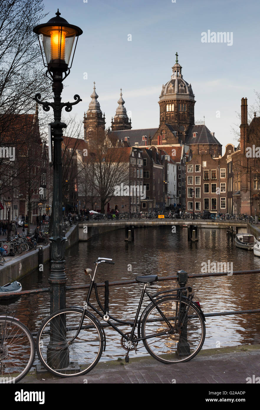Typical Amsterdam canal scene with Basilica of St. Nicholas in the ...