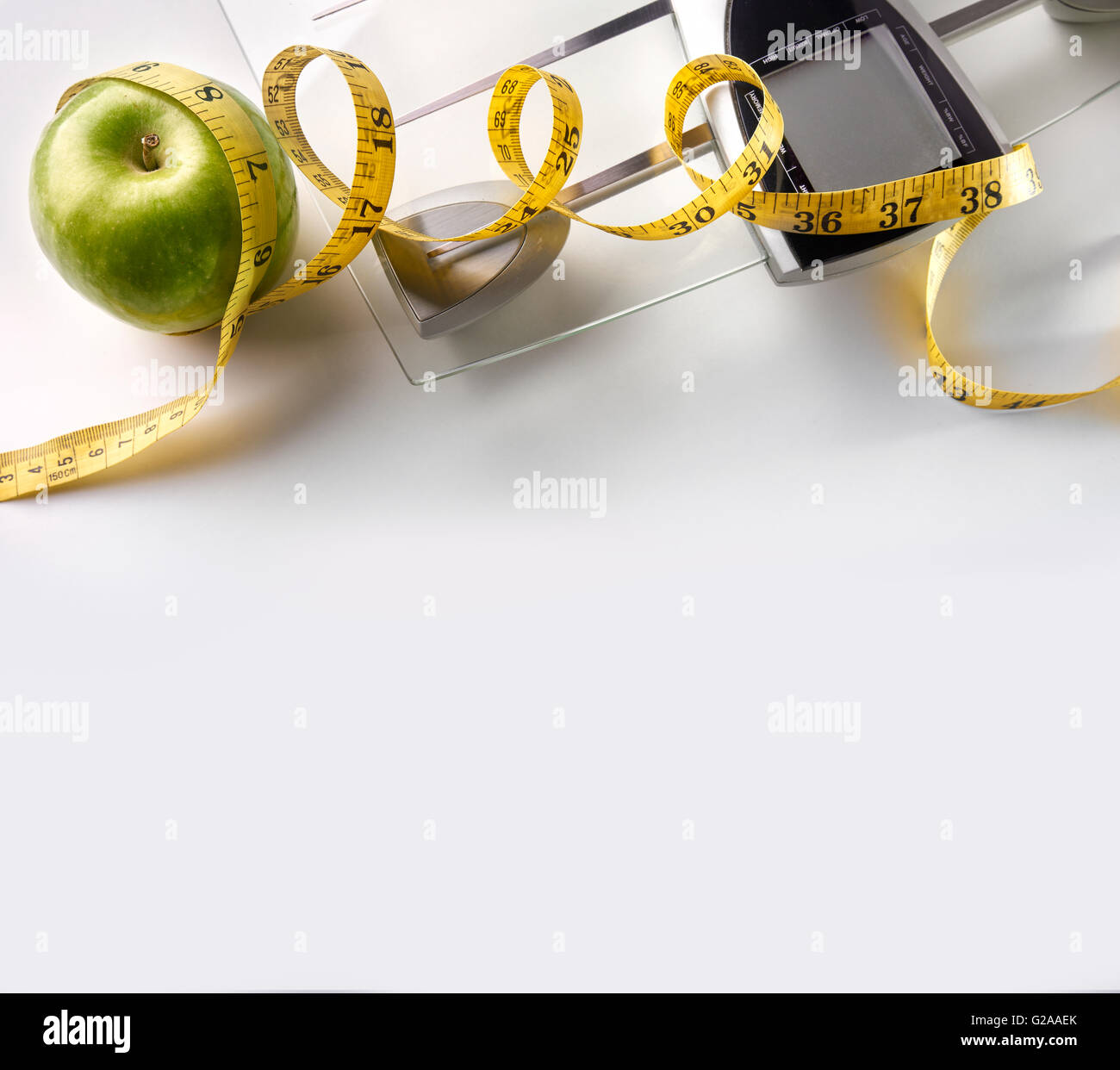 Scale with apple and tape measure isolated. Concept health, diet and ...