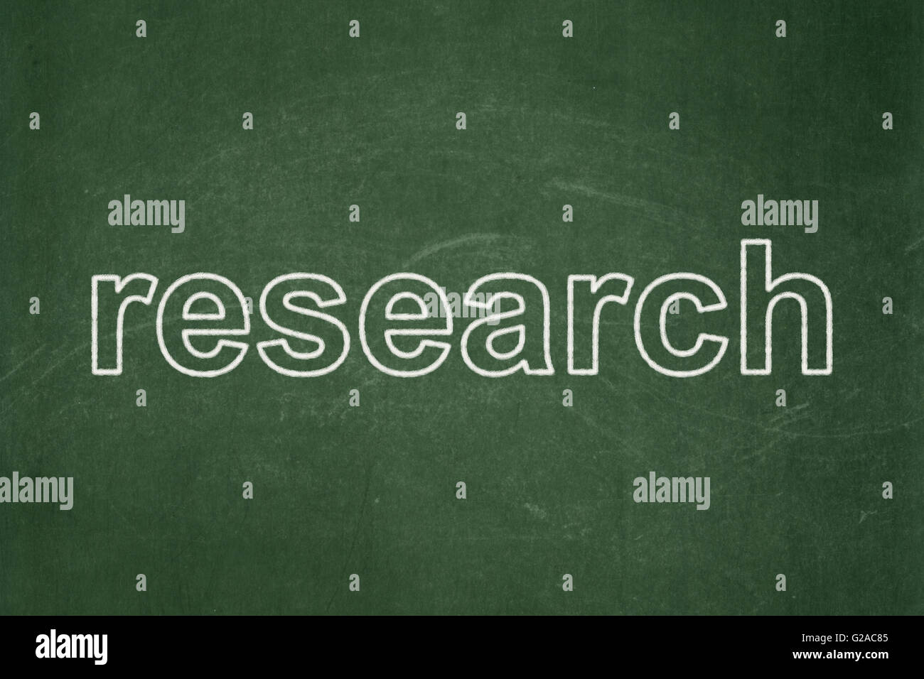 Advertising concept: Research on chalkboard background Stock Photo - Alamy