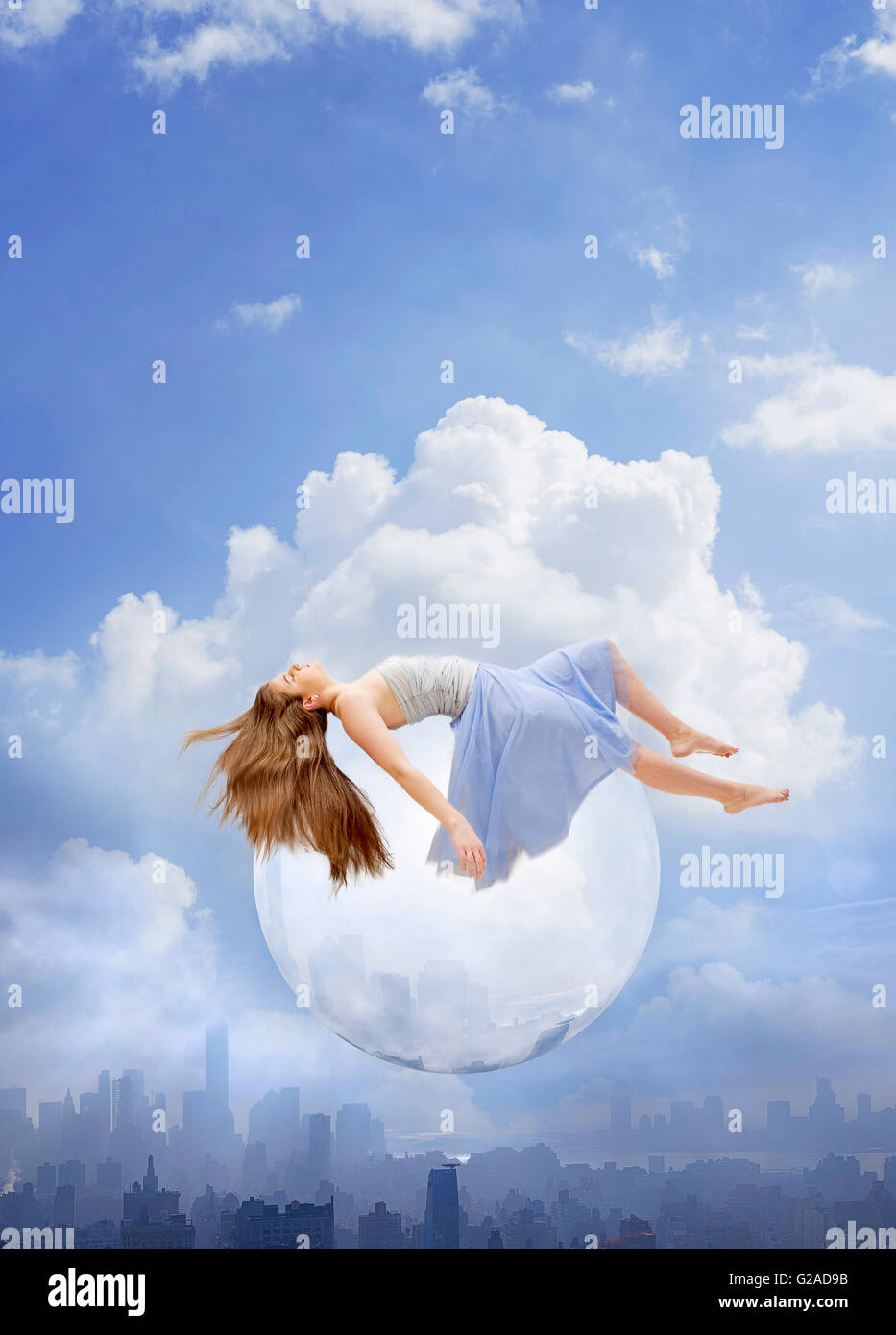 Young woman floating on bubble over cityscape Stock Photo - Alamy