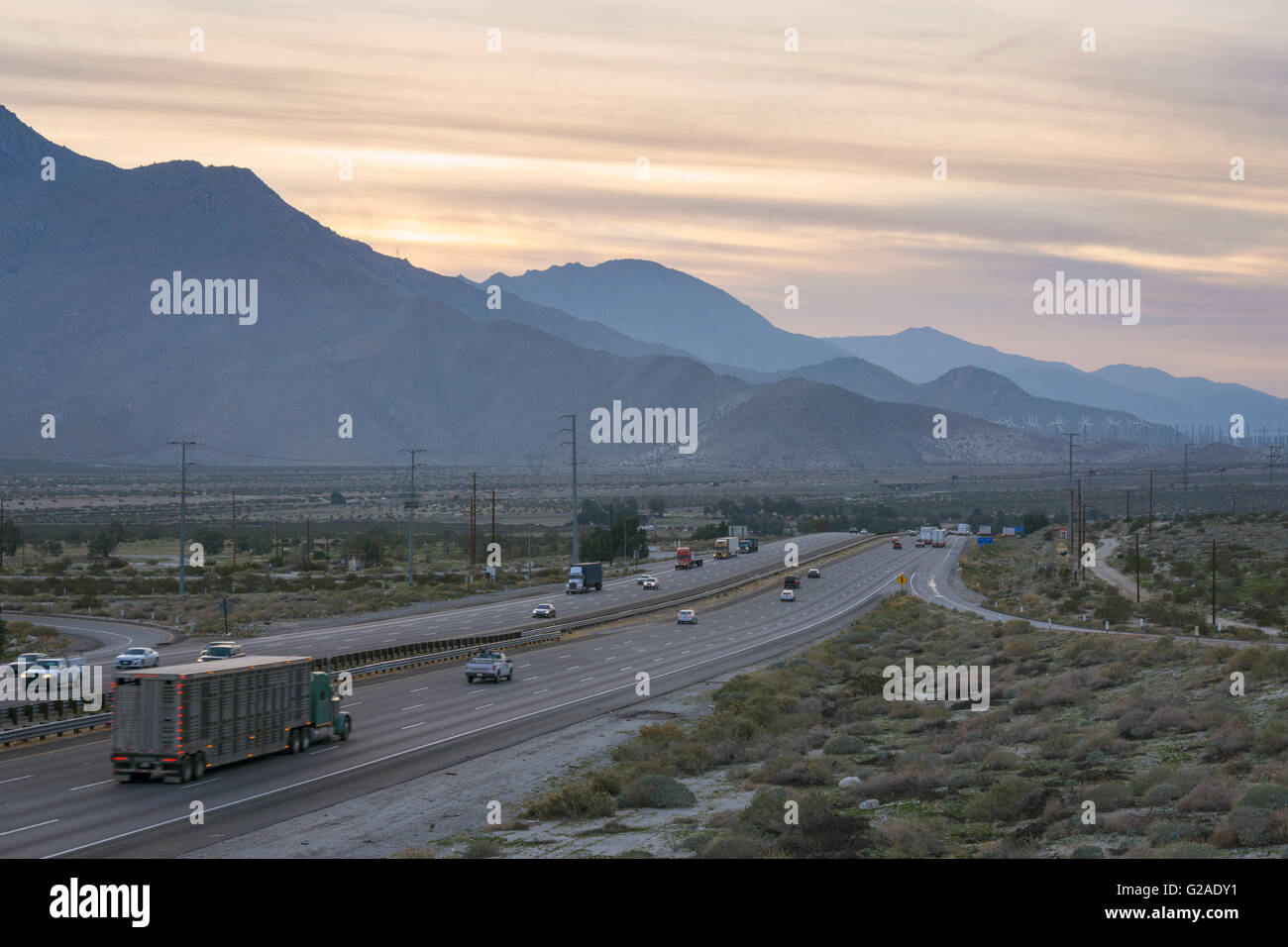 I-10 highway along mountains at sunset Stock Photo - Alamy