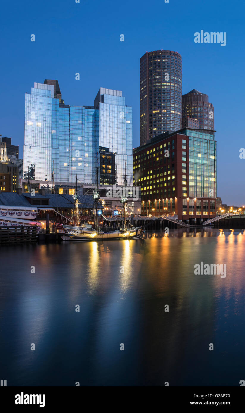 Skyscrapers reflecting on water surface at dawn Stock Photo - Alamy