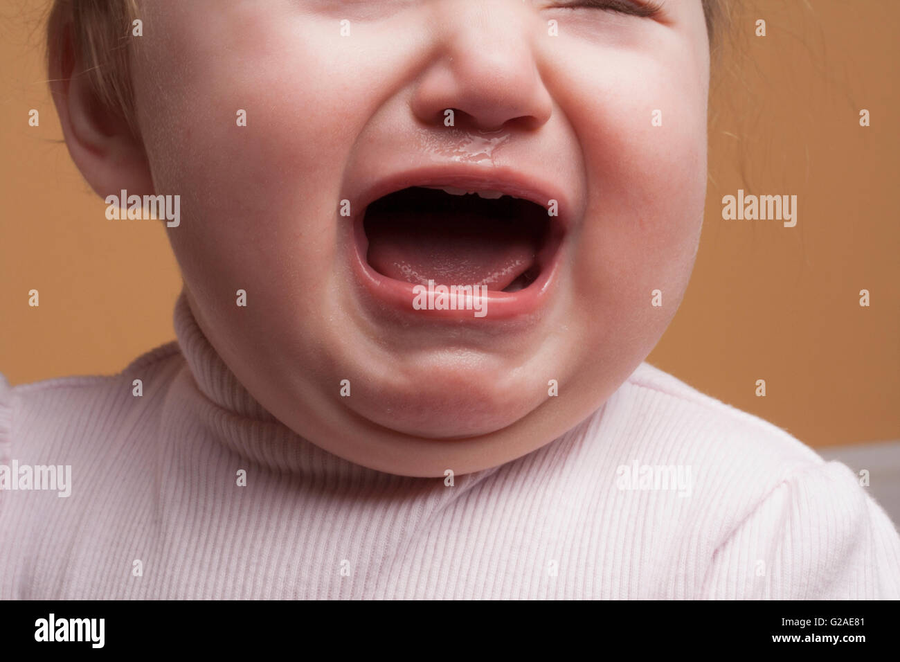 Baby girl crying Stock Photo - Alamy