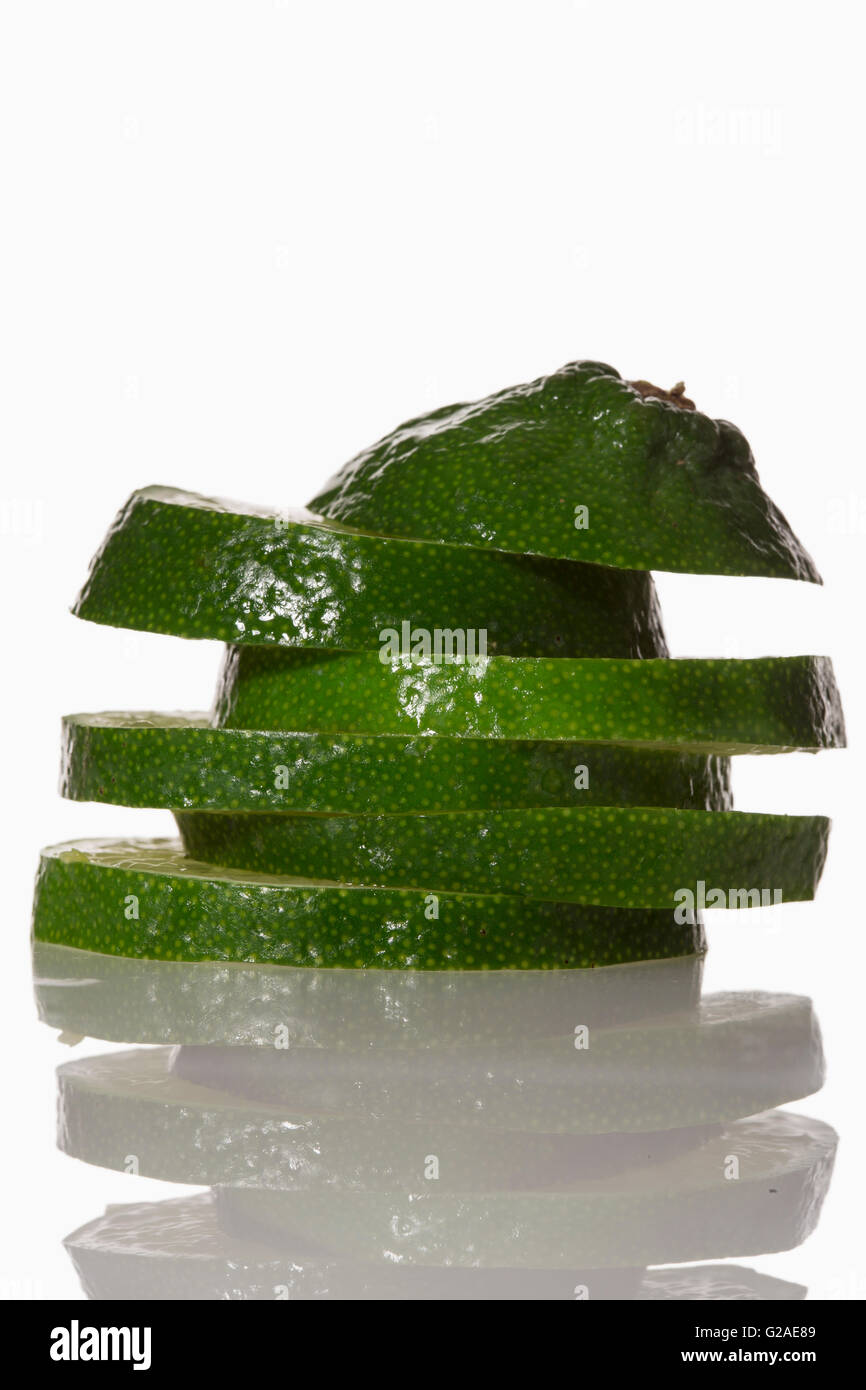Lime slices on white background background hi-res stock photography and ...