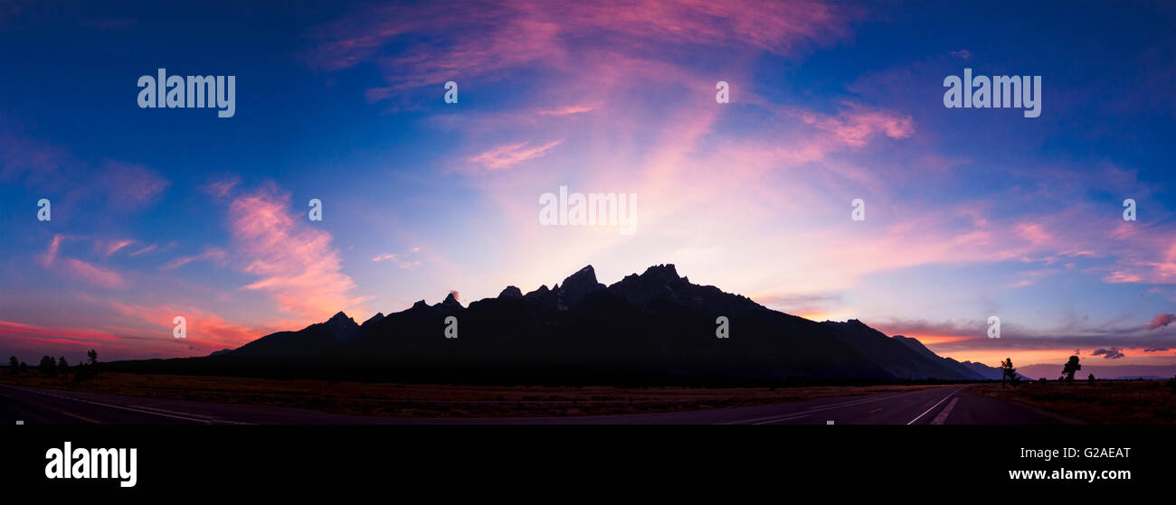 Sunset over mountains Stock Photo - Alamy