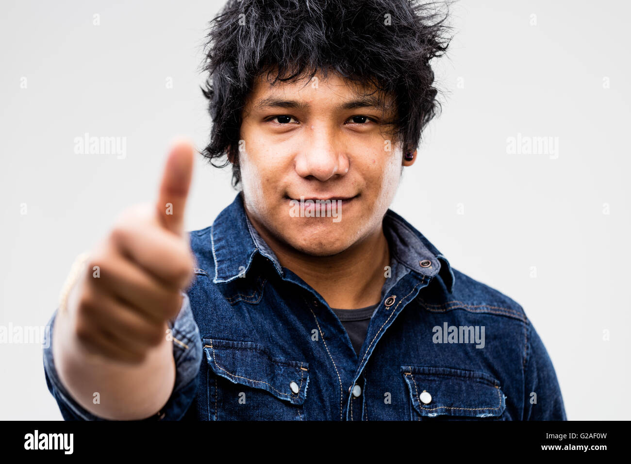 thumbs up and go for this afro-colombian robust boy Stock Photo - Alamy
