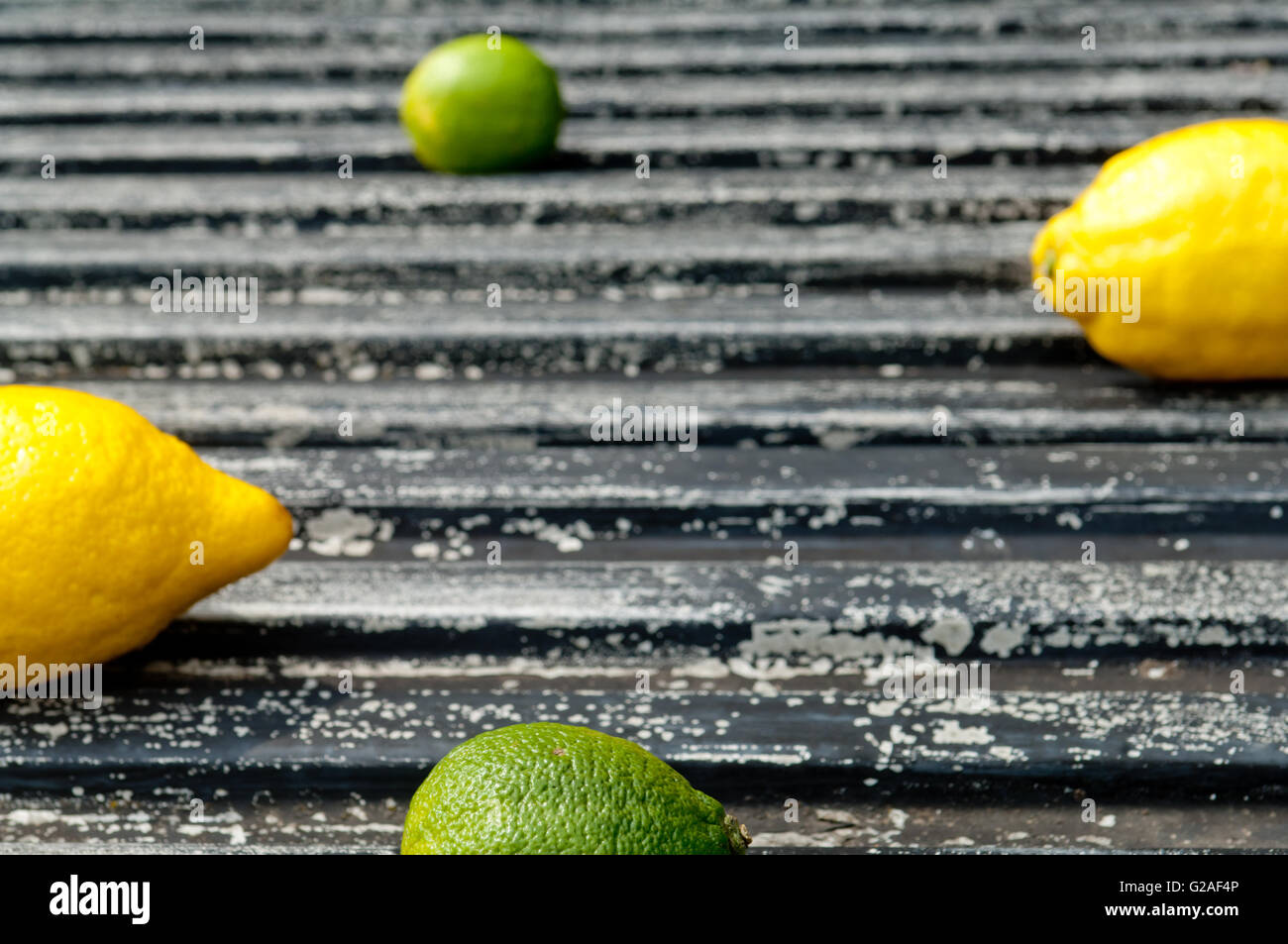 Lemons on old, dark, painted metal surface with copy space Stock Photo ...