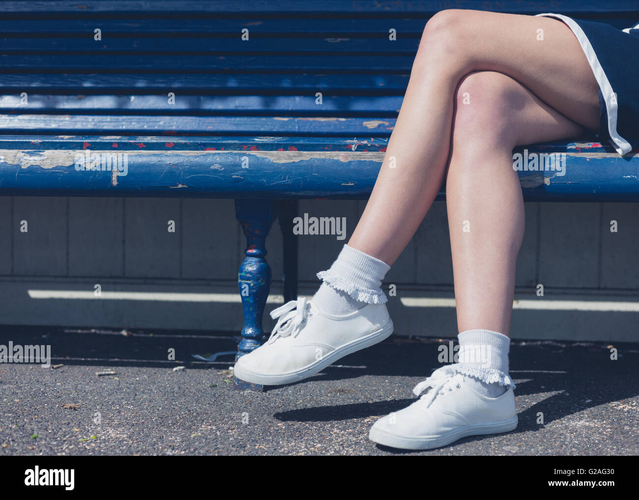 Young woman feet on bench hi-res stock photography and images - Alamy