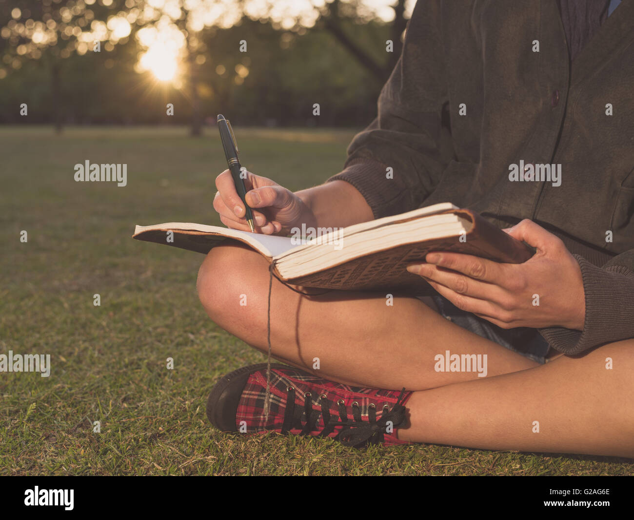 Woman writing diary outside hi-res stock photography and images - Alamy