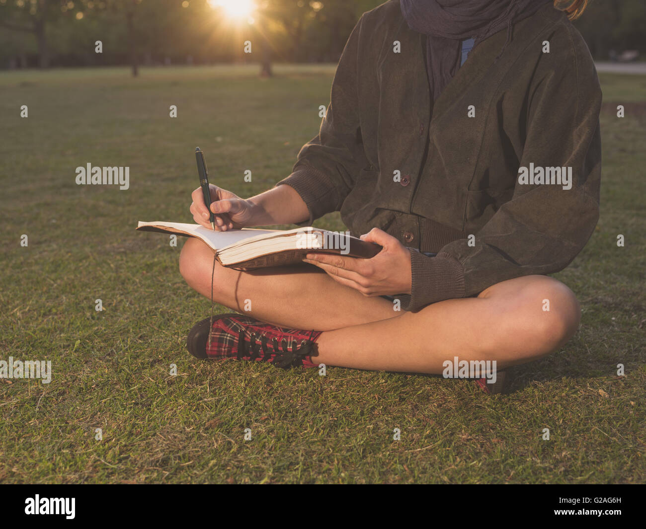Woman writing diary outside hi-res stock photography and images - Alamy