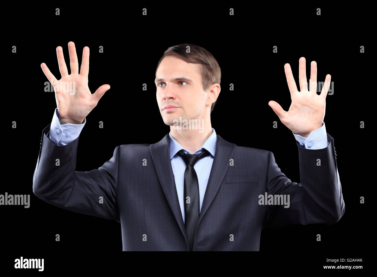 Business Man pushing on a touch screen interface. Black background ...