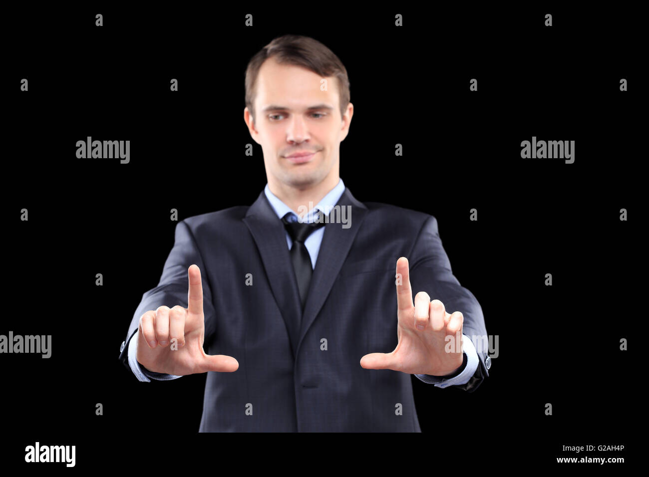 Business Man pushing on a touch screen interface. Black background ...