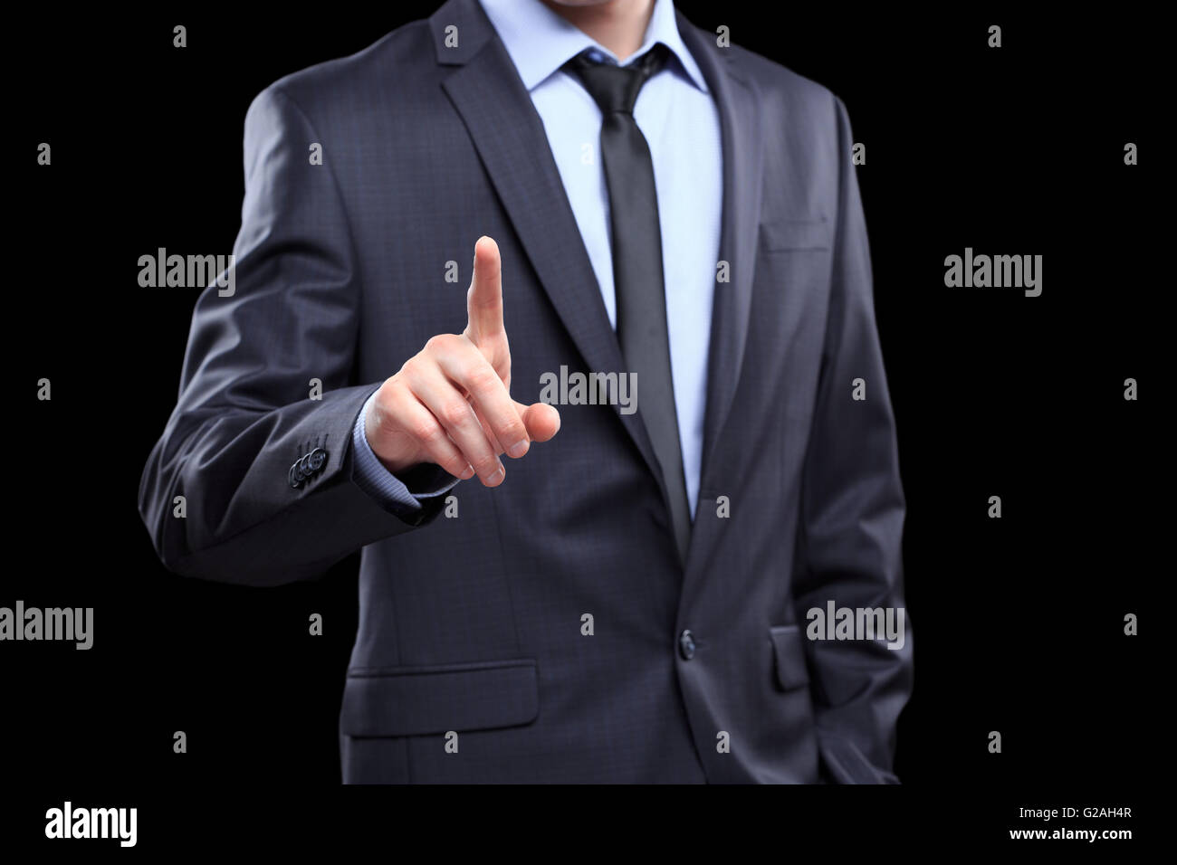 Business Man pushing on a touch screen interface. Black background ...
