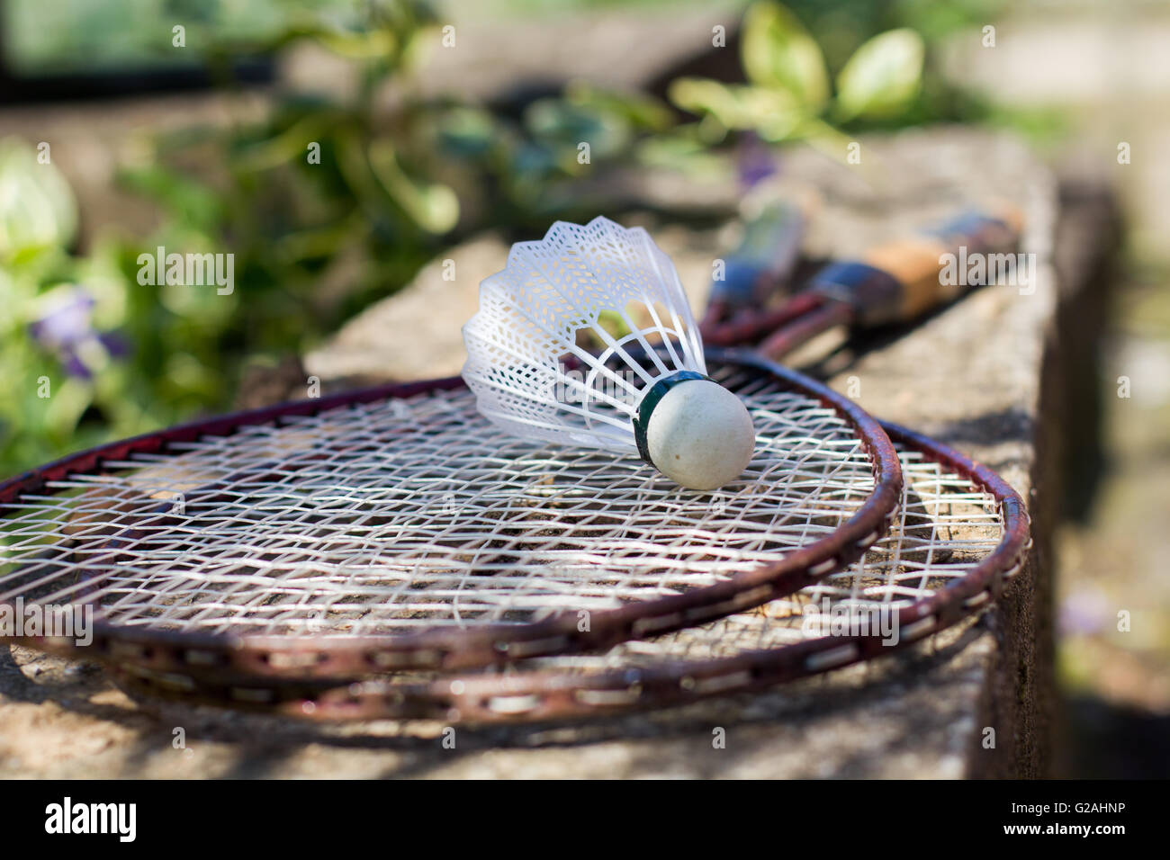 Old fashioned badminton racket and shuttlecock outdoor Stock Photo - Alamy