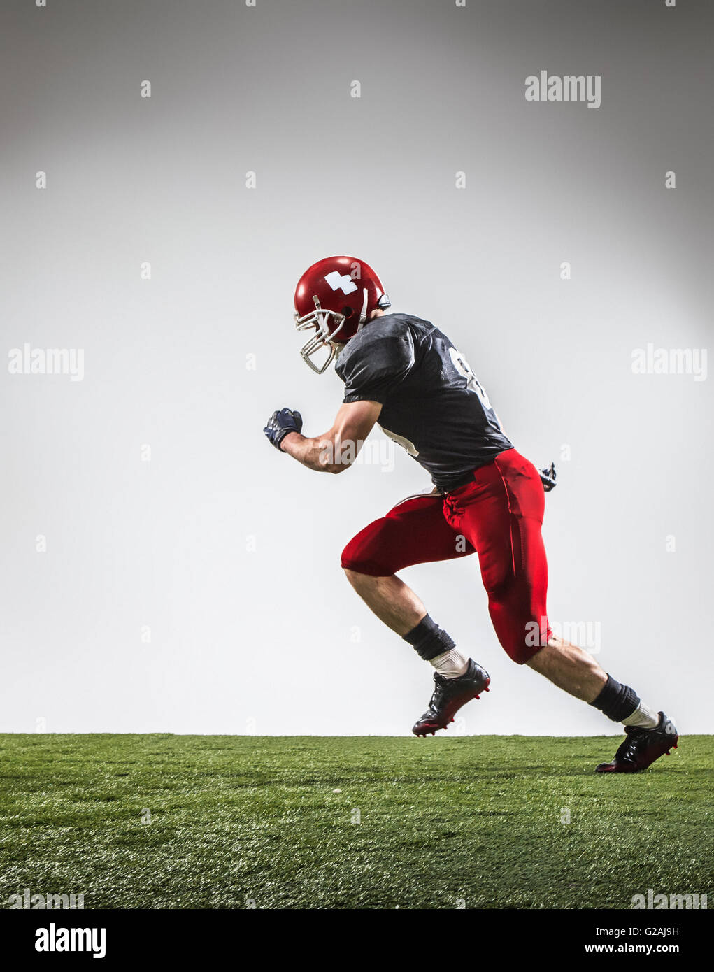 The american football player in action Stock Photo - Alamy