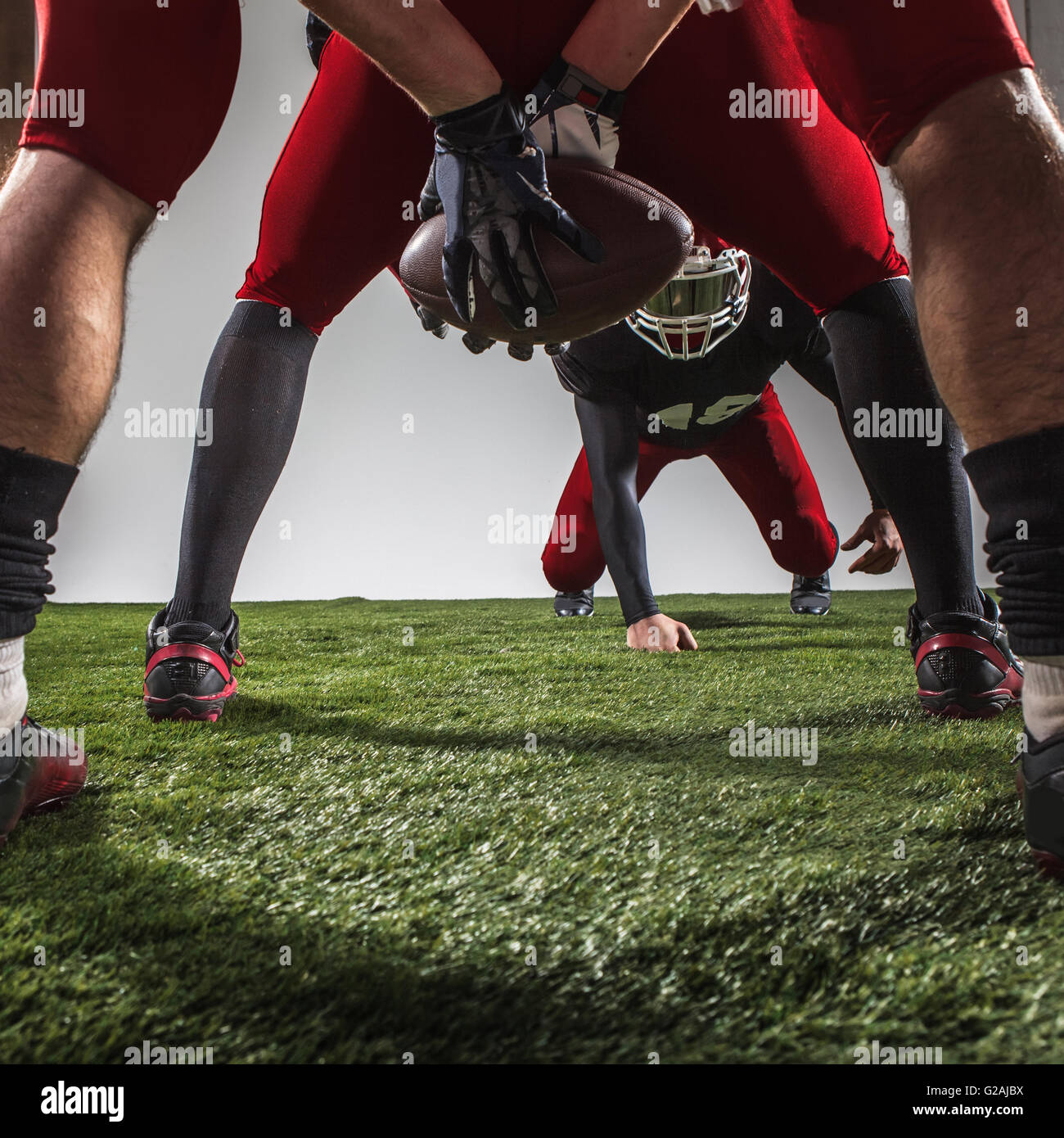 The three american football players in action Stock Photo - Alamy