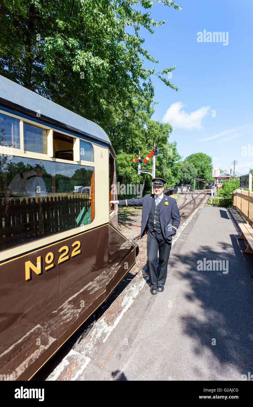 The guard of a former Great Western Railway vintage Railmotor at the ...