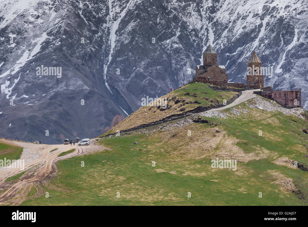 Georgia, Stepantsminda-Sameba. Ancient Gergeti Trinity Church high in ...