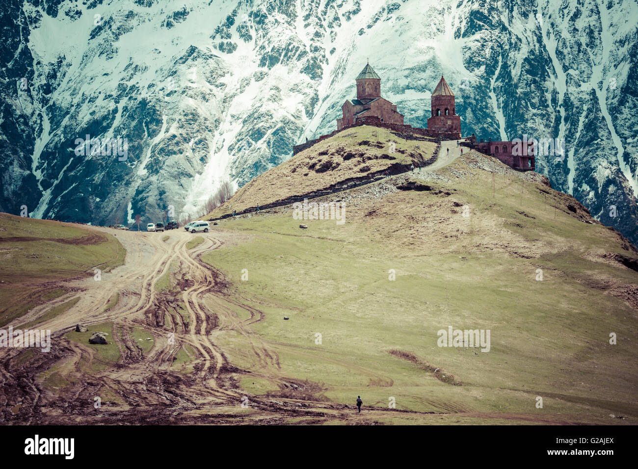 Georgia, Stepantsminda-Sameba. Ancient Gergeti Trinity Church high in ...